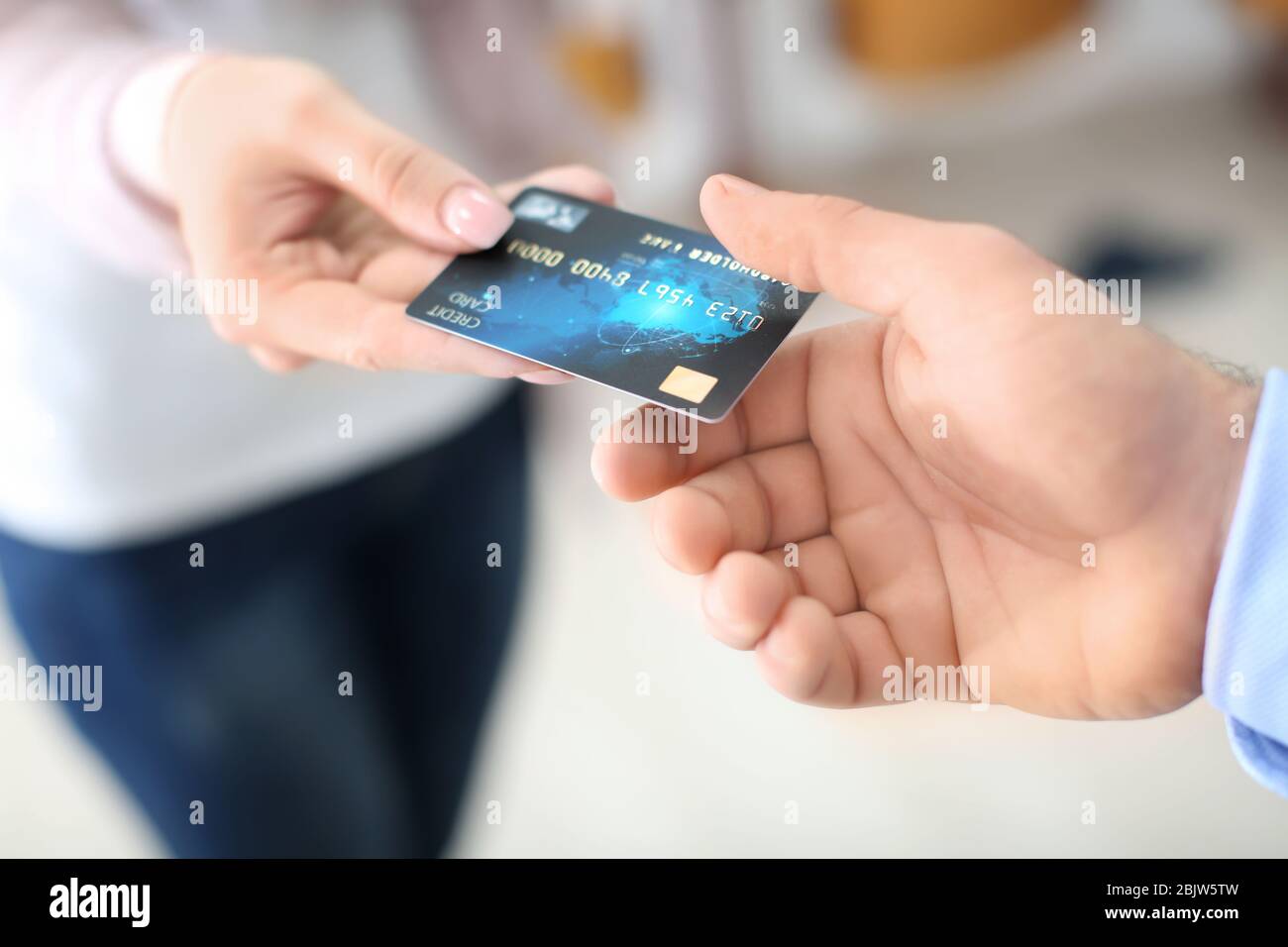 Woman giving credit card to hi-res stock photography and images - Alamy