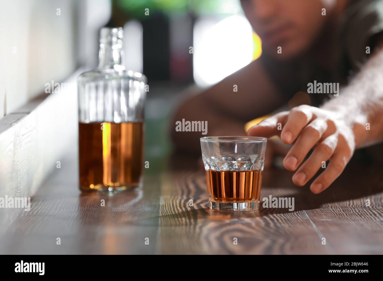 Hand reaching glass alcoholic drink hi-res stock photography and images ...