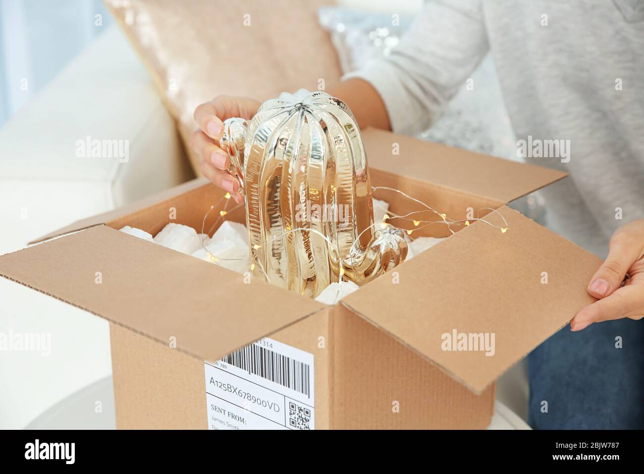 Opening parcel hi-res stock photography and images - Alamy