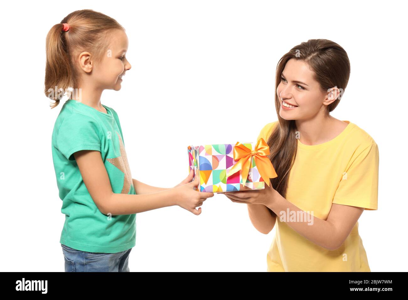 Cute little girl giving present to her mother on white background Stock ...
