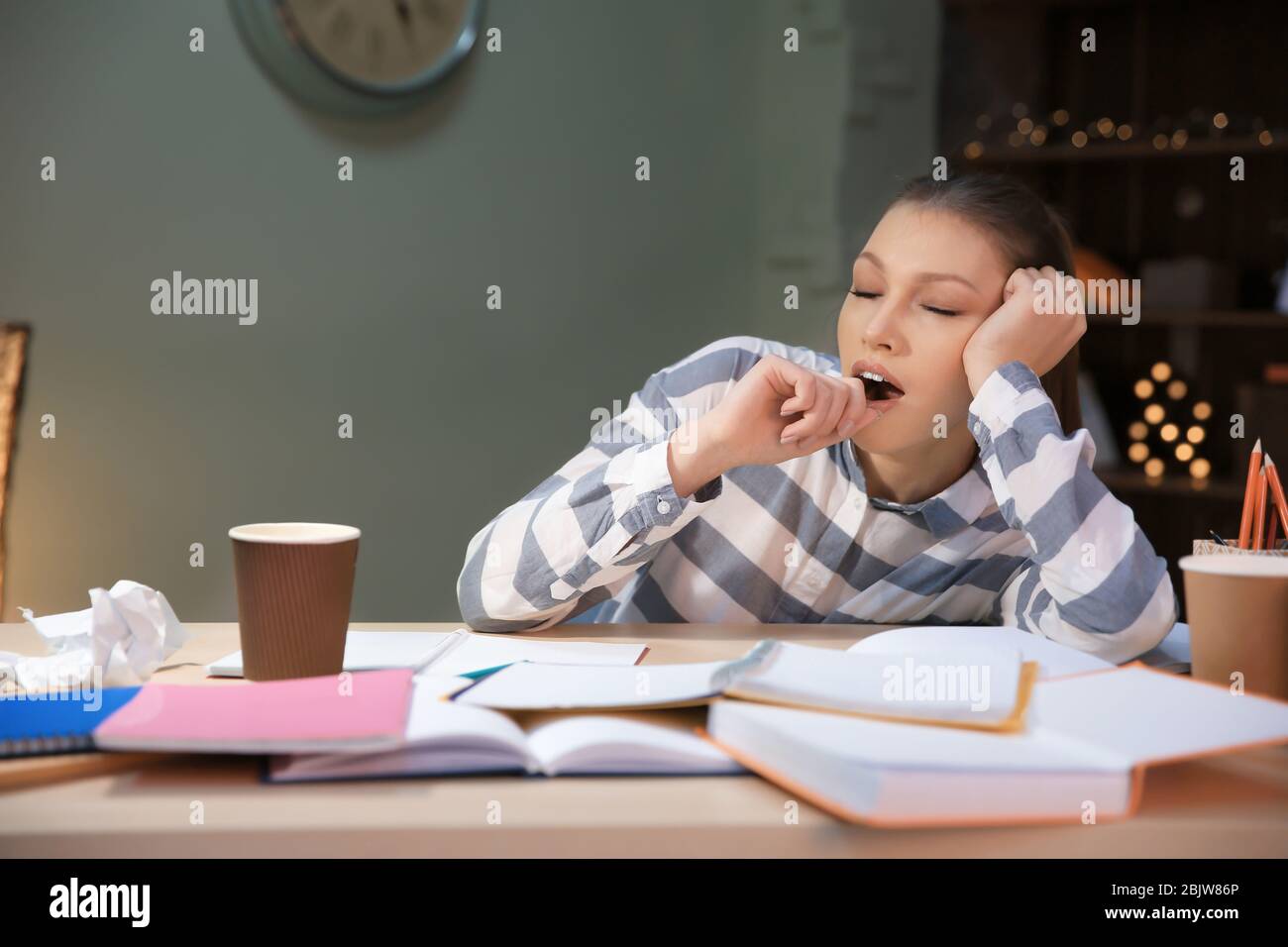 Female student studying night tired hi-res stock photography and images ...