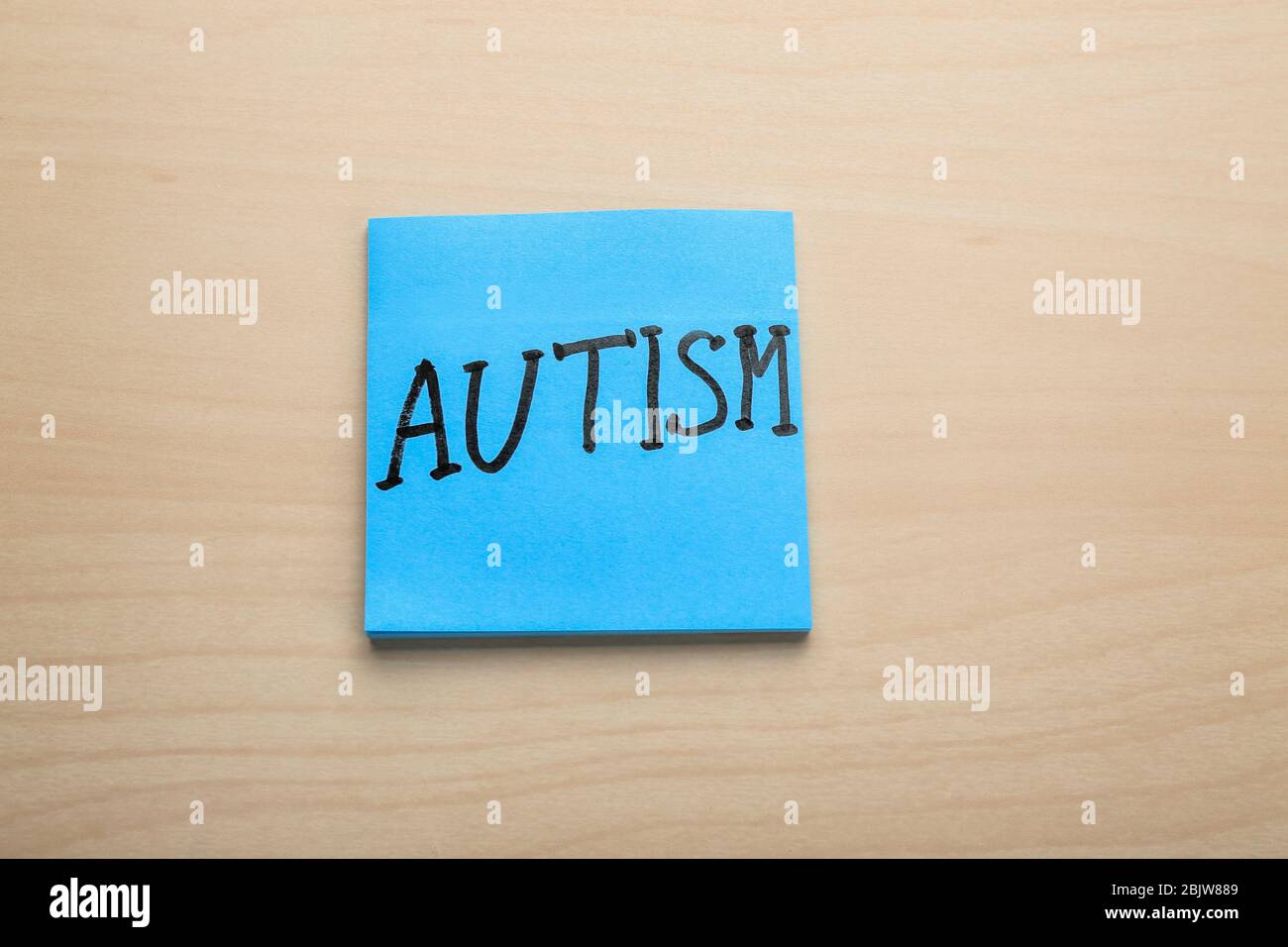 Sticky note with word "Autism" on light background Stock Photo - Alamy