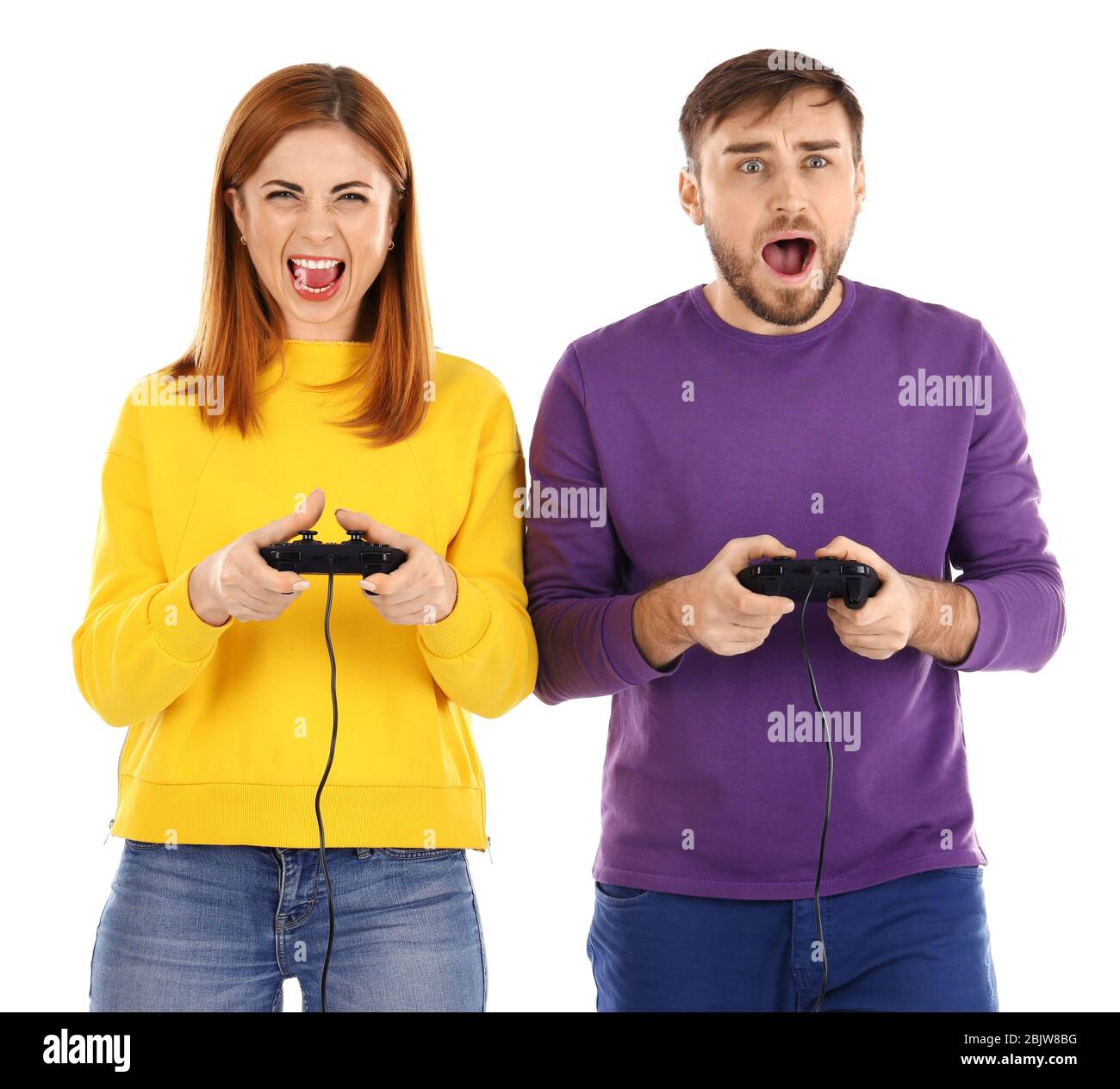 Emotional couple playing video game on white background Stock Photo - Alamy