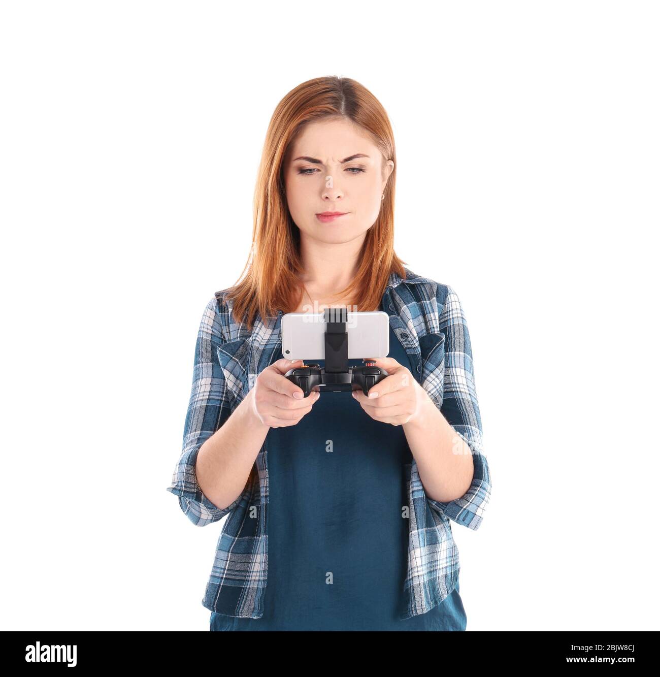 Emotional woman with video game controller for smartphone on white ...