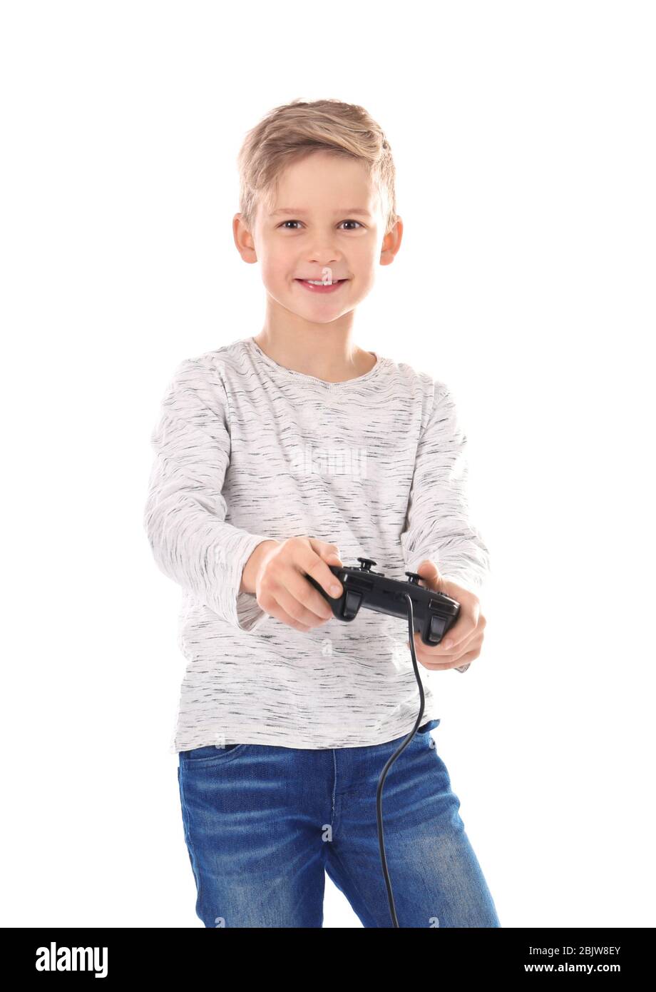 Cute boy with video game controller on white background Stock Photo - Alamy