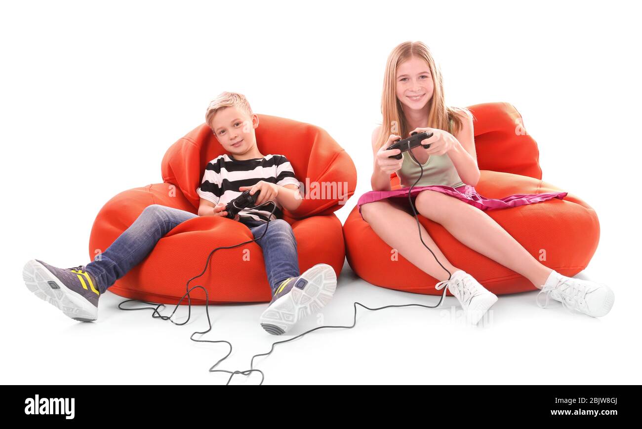 Cute children playing video game on white background Stock Photo - Alamy