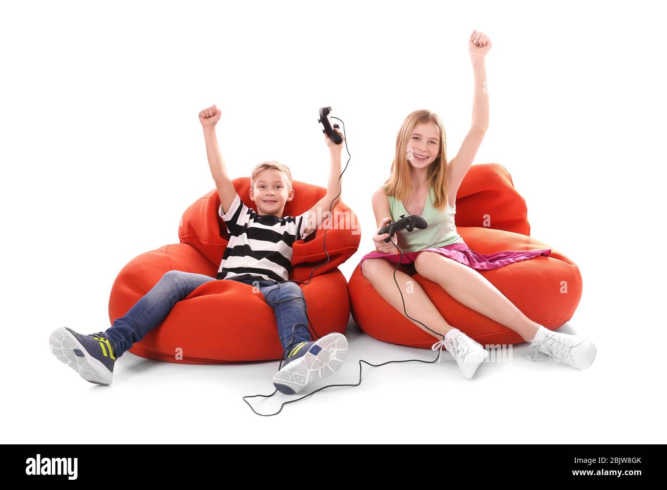 Happy children with video game controllers on white background Stock ...