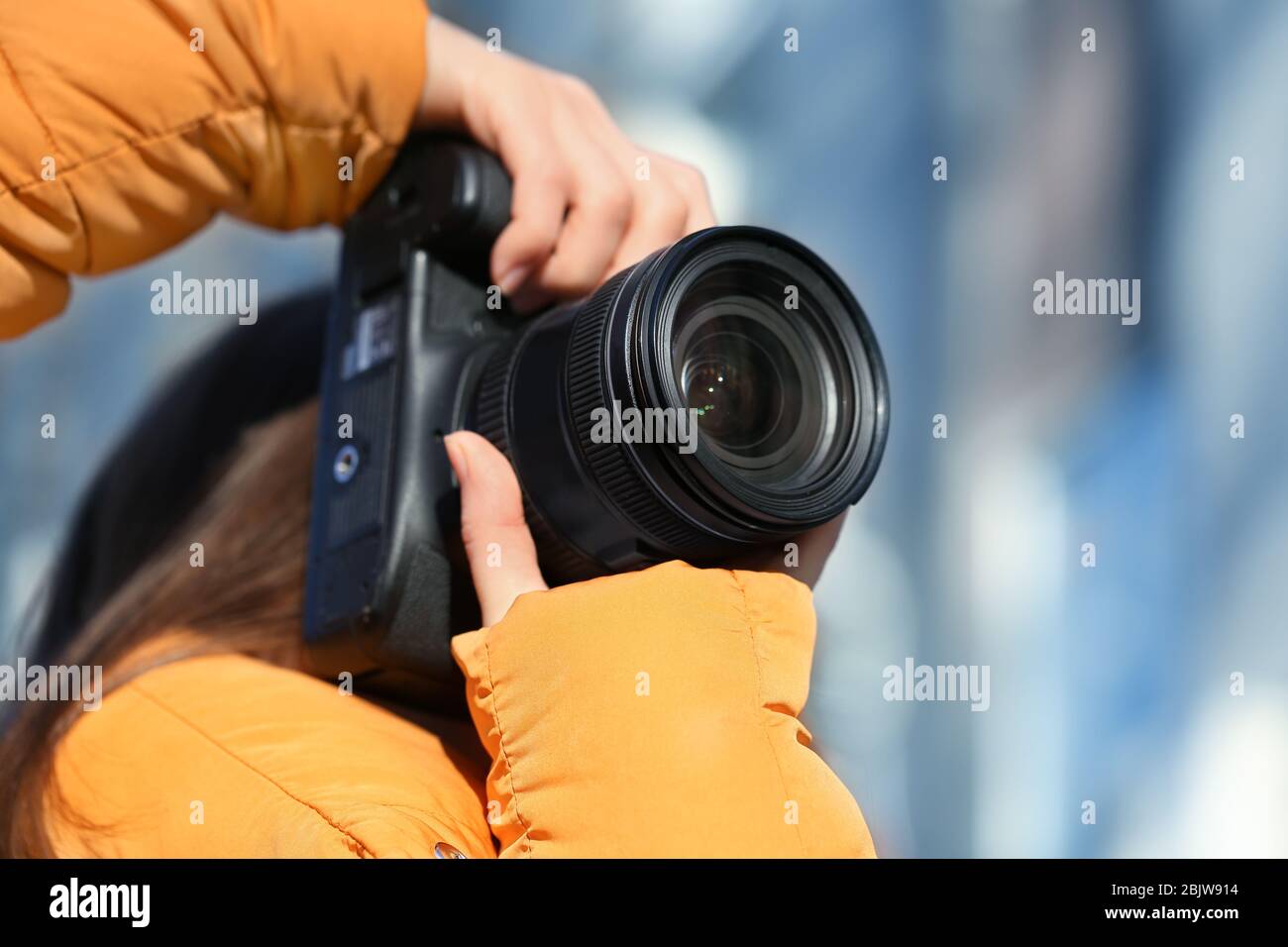 Female photographer with camera outdoors Stock Photo - Alamy