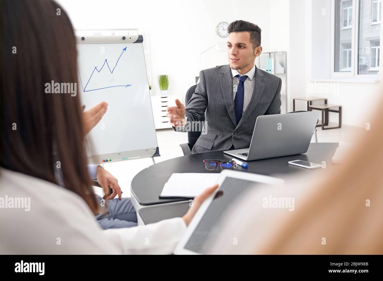 Business trainer giving presentation at management seminar Stock Photo ...
