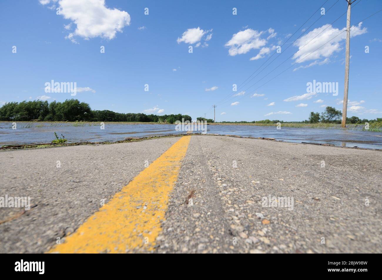 Flooded street in rural highway through farm land Stock Photo - Alamy