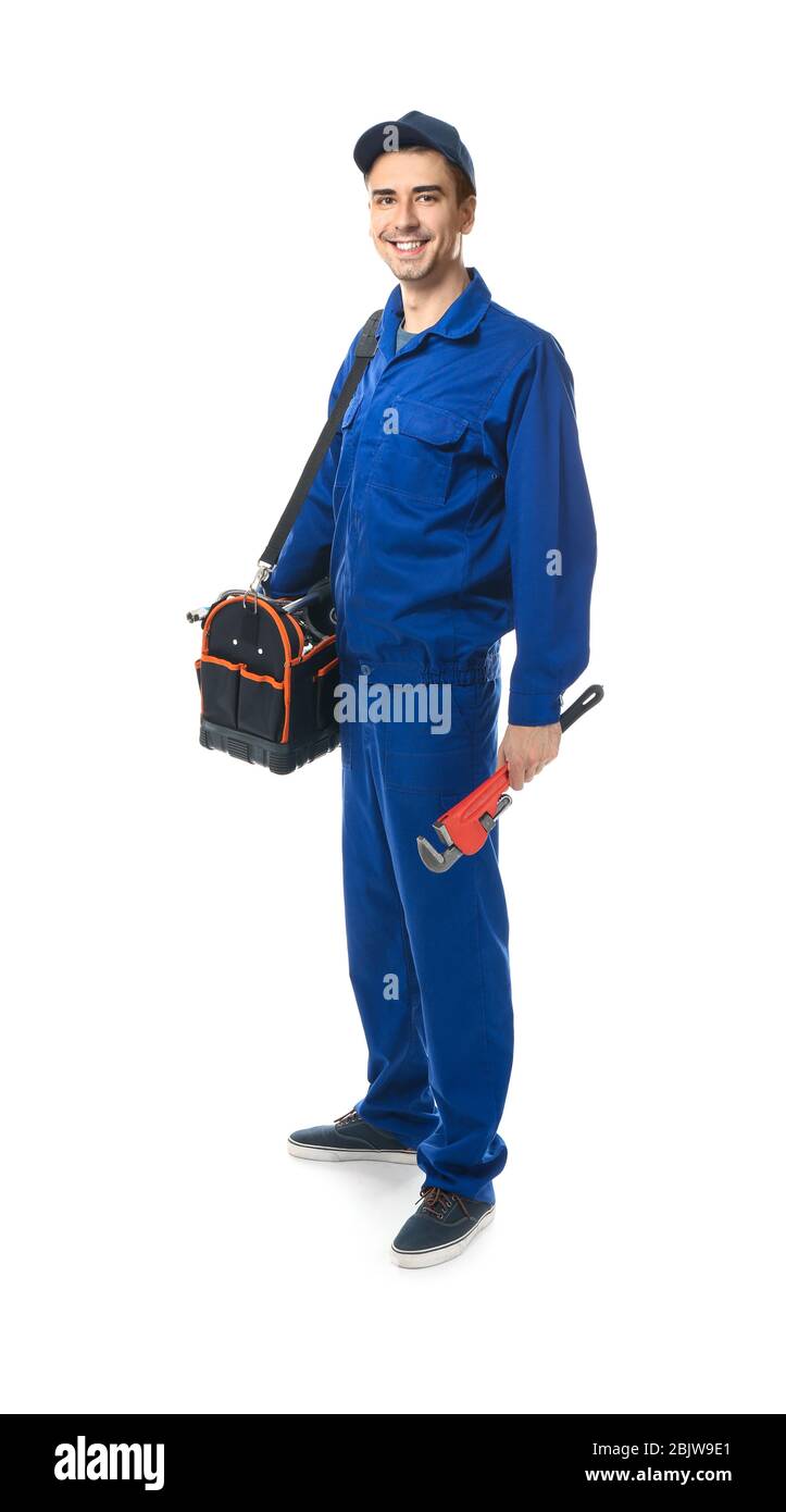 Young plumber in uniform with tool bag and pipe wrench on white ...