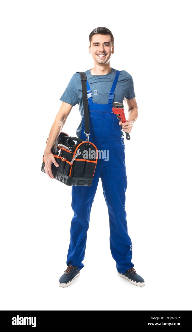 Young plumber in uniform with tool bag and pipe wrench on white ...