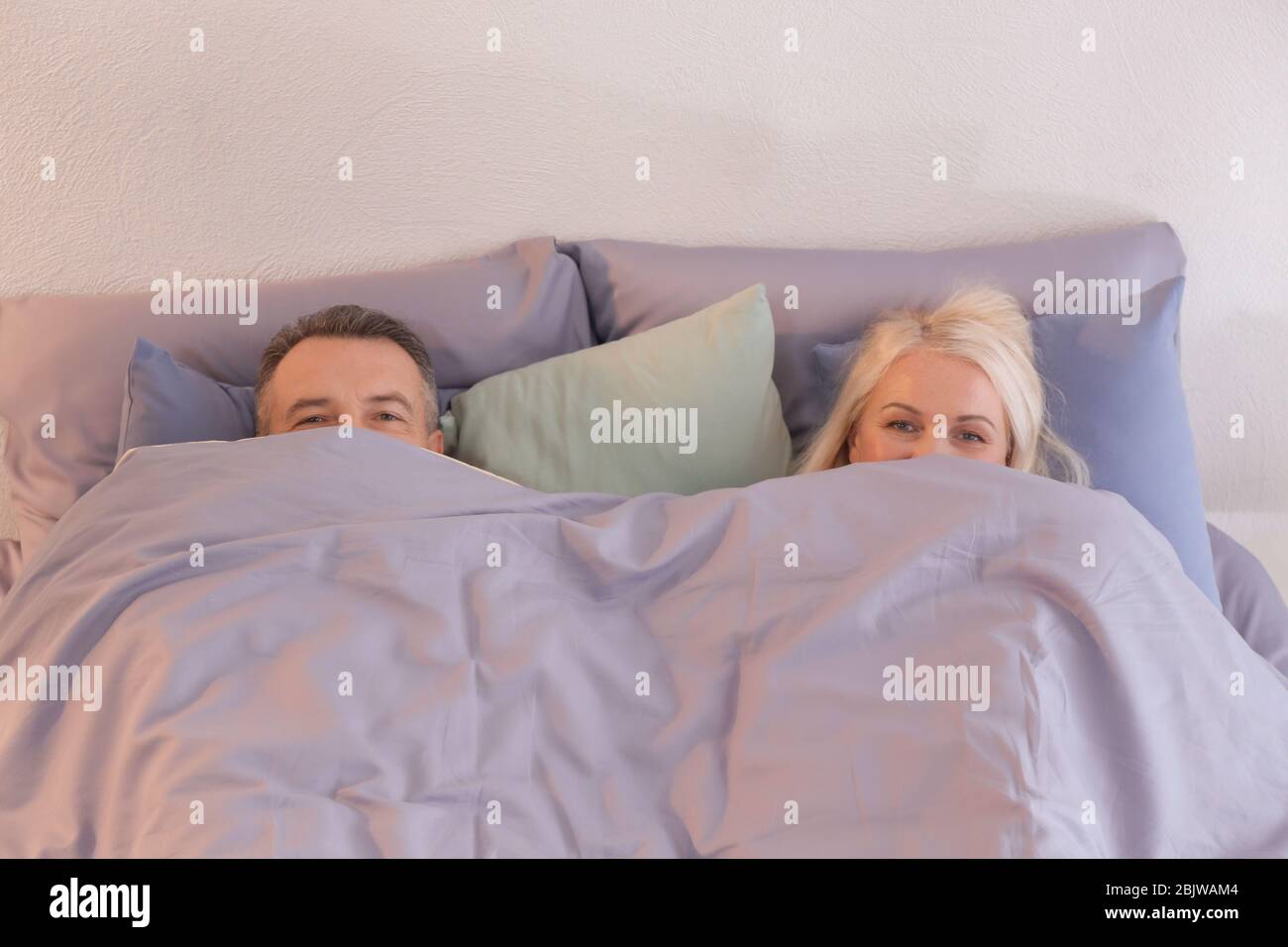 Hiding under bed man woman hi-res stock photography and images - Alamy