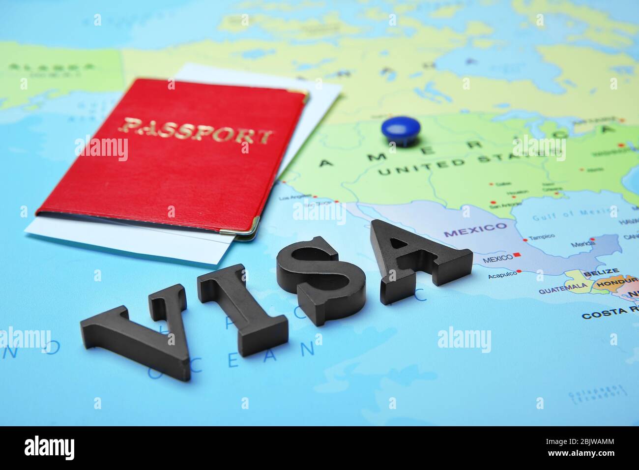 Passport and word VISA on map Stock Photo - Alamy