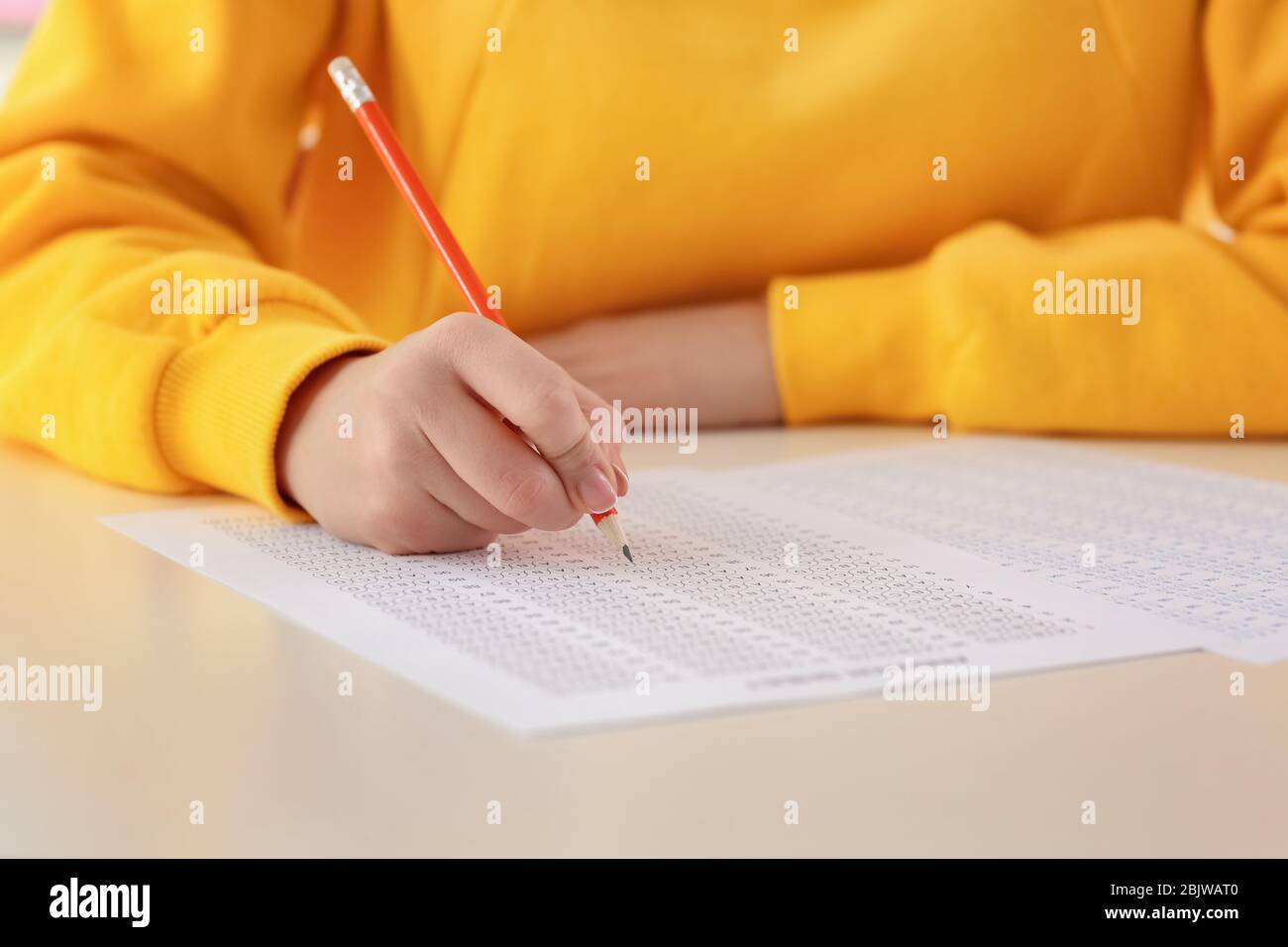 Student writing test to pass exam, closeup Stock Photo - Alamy