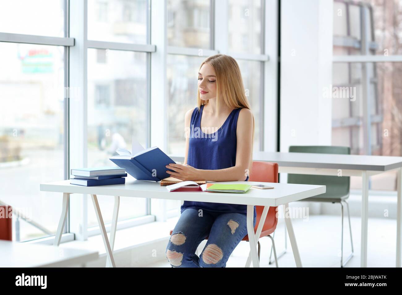 Student preparing for exam in classroom Stock Photo - Alamy