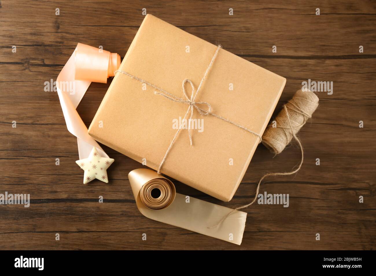 Composition with parcel gift box on wooden background Stock Photo - Alamy