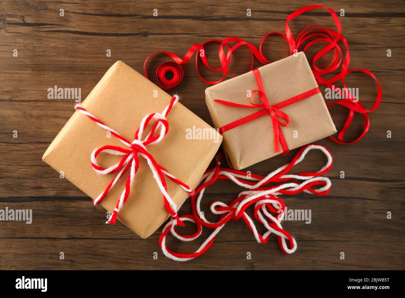 Parcel gift boxes on wooden table Stock Photo - Alamy