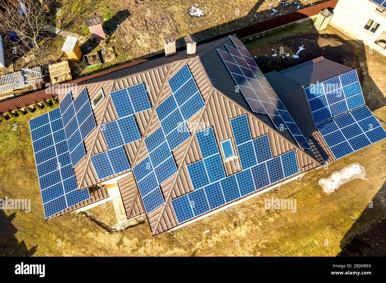 Aerial top view of new modern residential house cottage with blue shiny ...