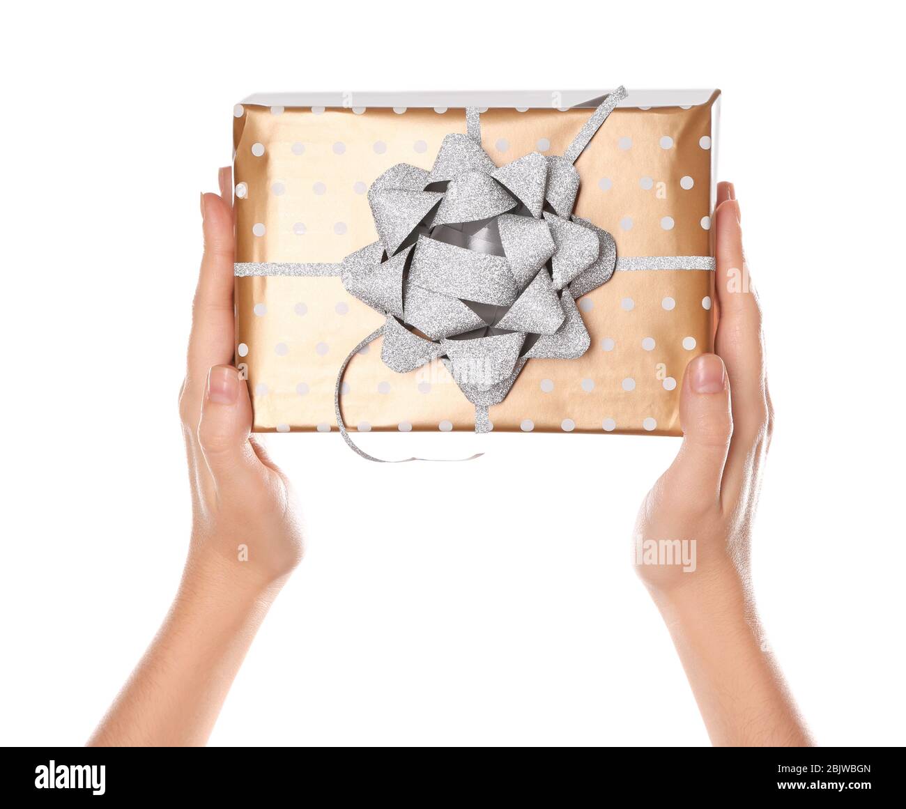 Woman holding golden gift Cut Out Stock Images & Pictures - Alamy