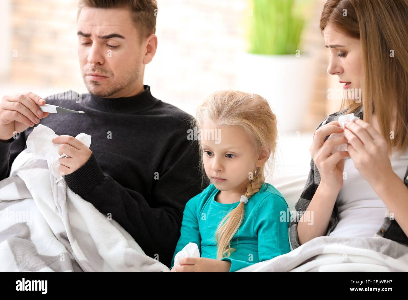 Sick family in bed hi-res stock photography and images - Alamy