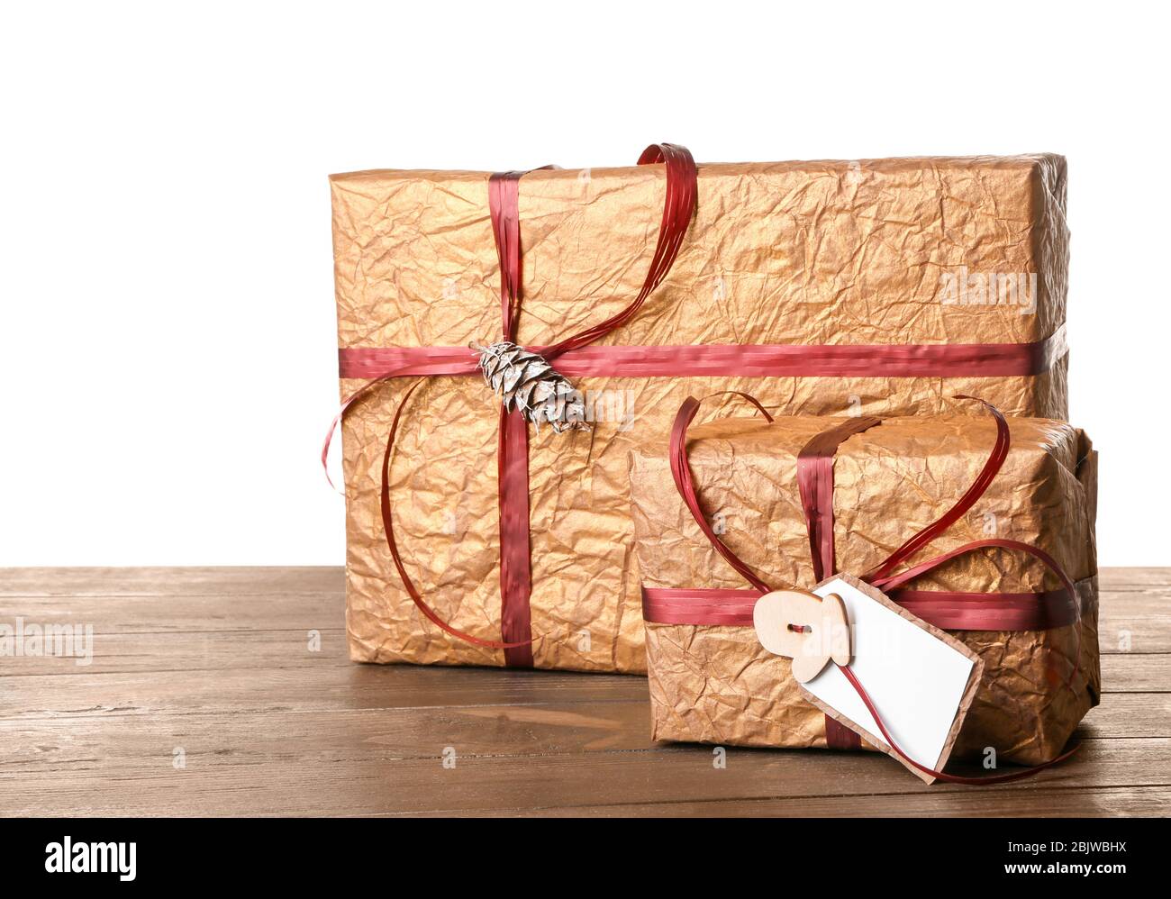 Beautiful Christmas gift boxes on table against white background Stock ...