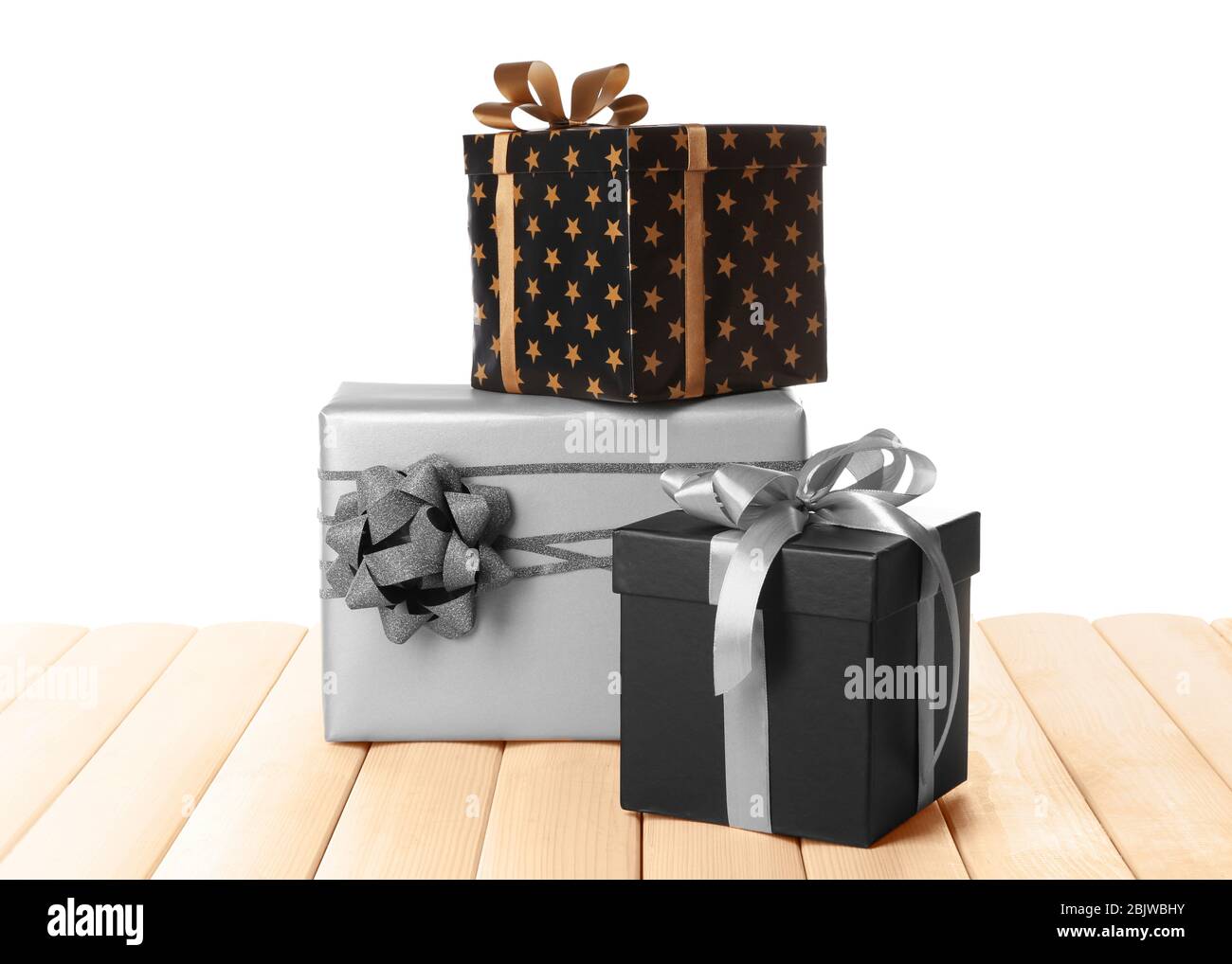 Beautiful gift boxes on table against white background Stock Photo - Alamy