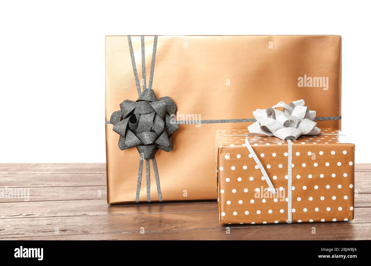 Beautiful gift boxes on table against white background Stock Photo - Alamy