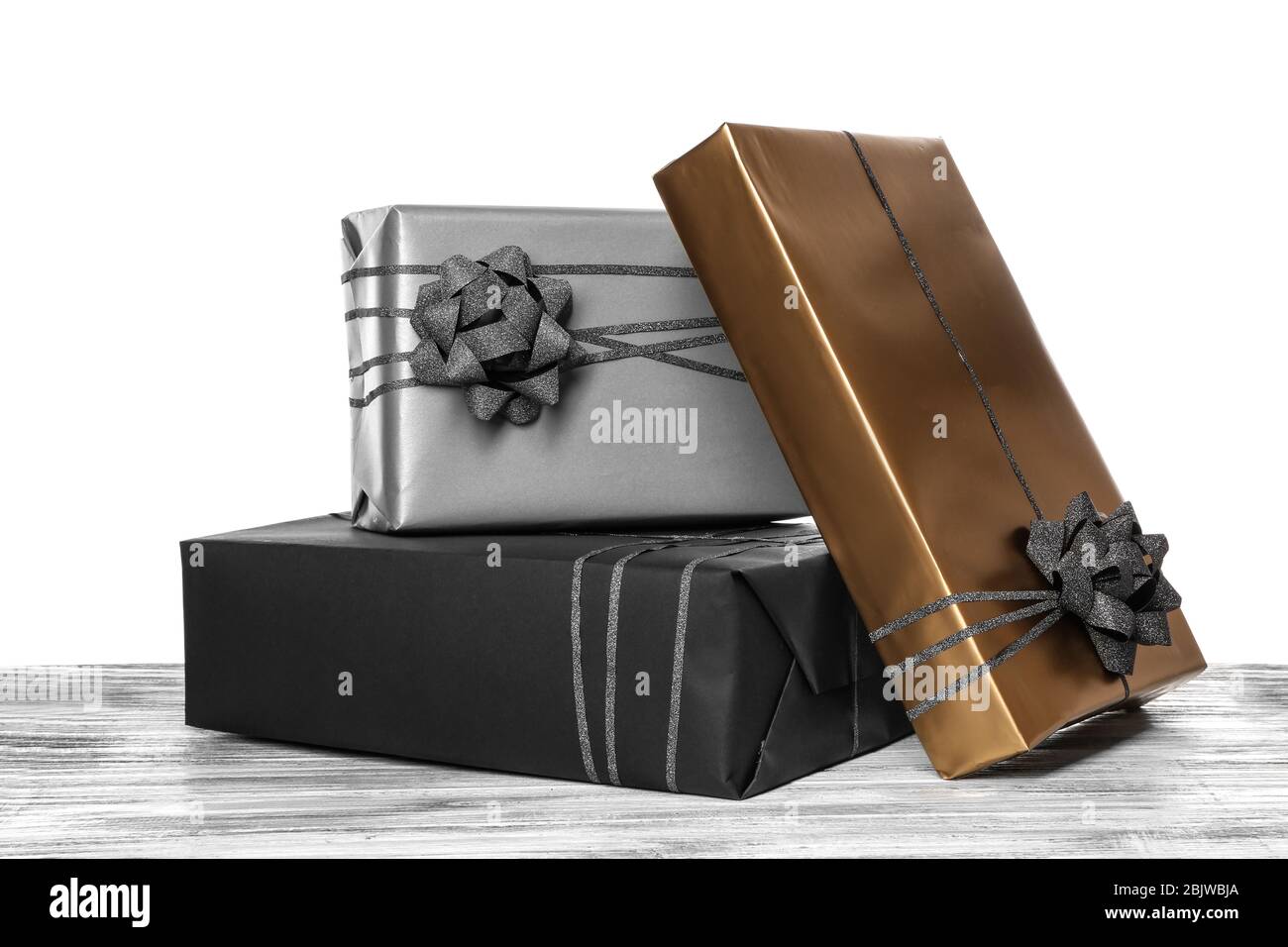 Beautiful gift boxes on table against white background Stock Photo - Alamy