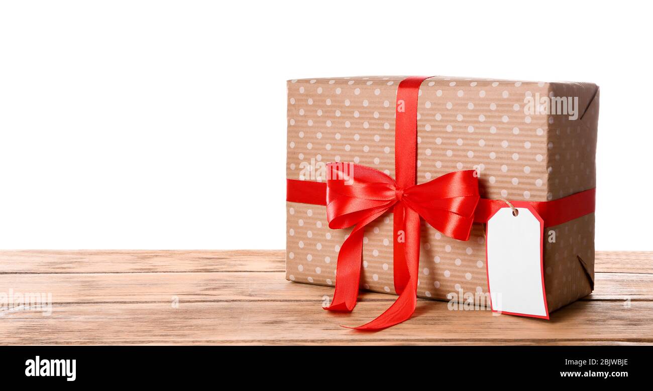 Beautiful gift box on table against white background Stock Photo - Alamy