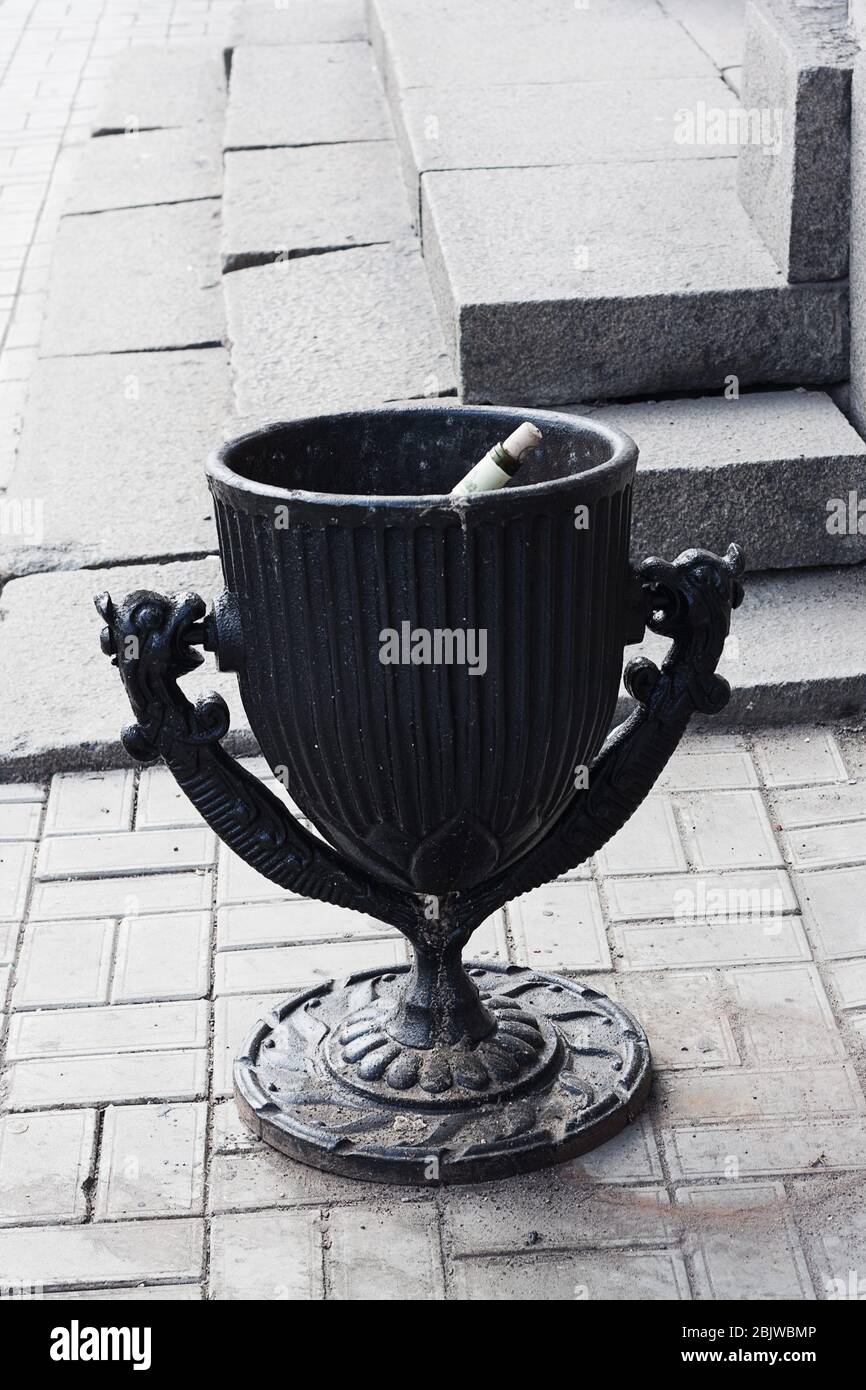 Ancient refuse bin with the animal and plant ornament against a ...