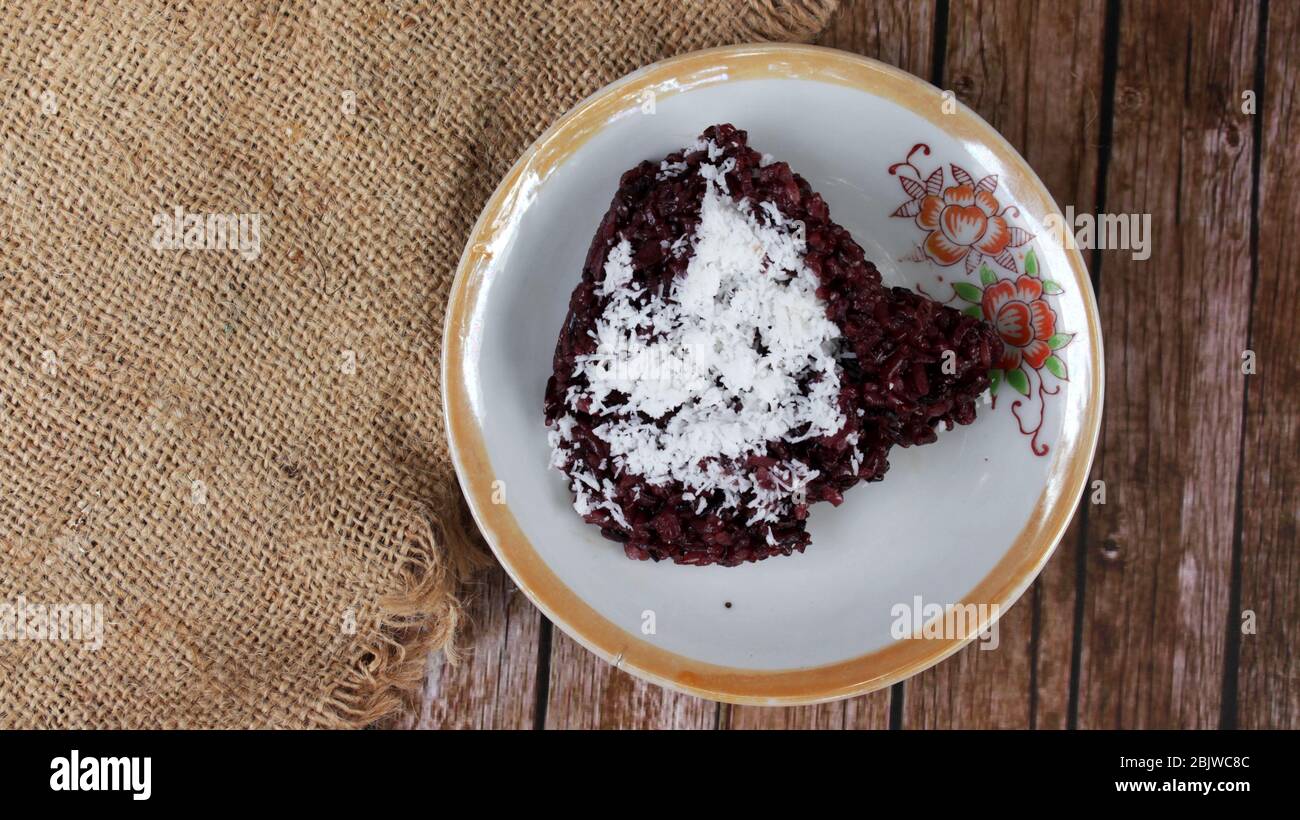 Black sticky rice or Ketan Hitam (Indonesian Name) with grated coconut ...