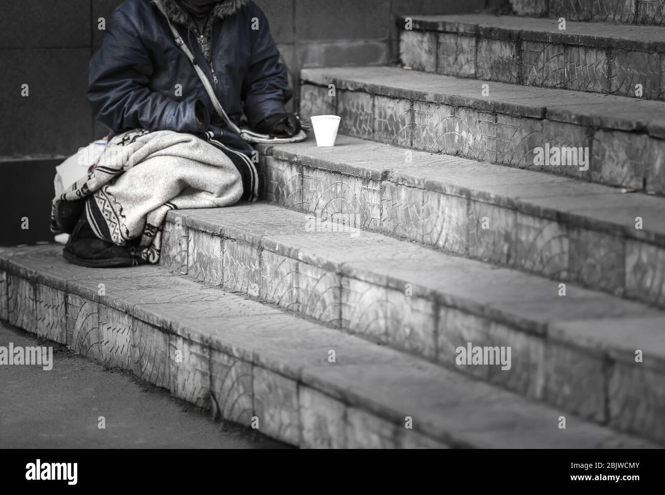 Homeless poor woman begging for money outdoors Stock Photo - Alamy