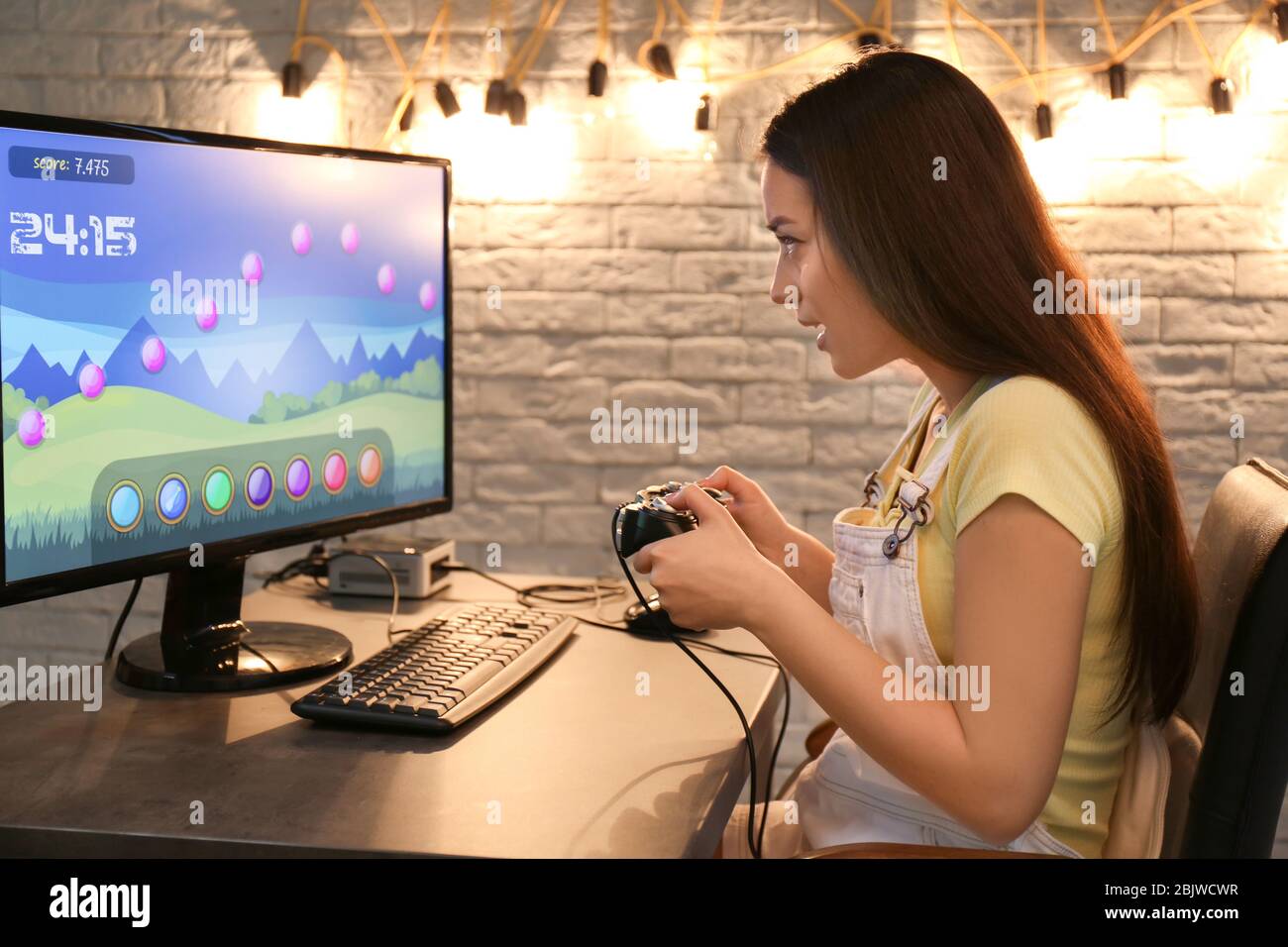Focused woman playing video game hi-res stock photography and images ...