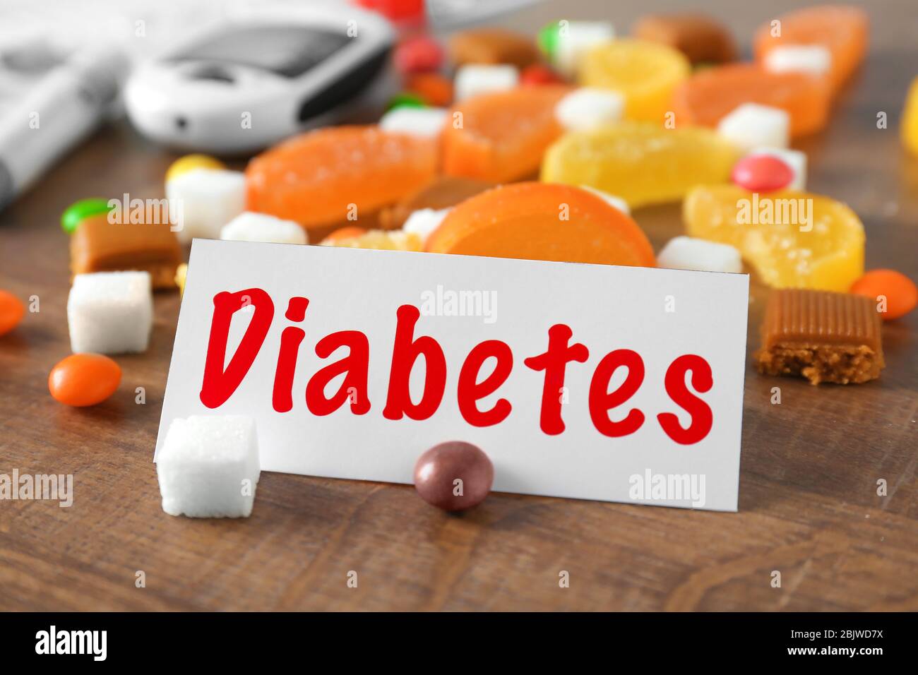 Card with word DIABETES and sweets on table Stock Photo - Alamy
