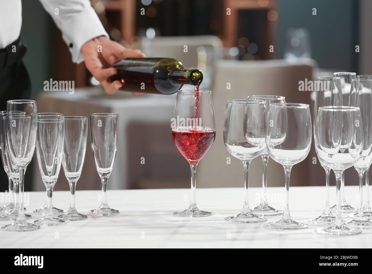 Male waiter butler serving pouring hi-res stock photography and images ...