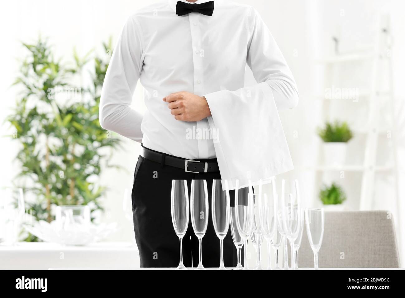 Male waiter in uniform at workplace Stock Photo - Alamy