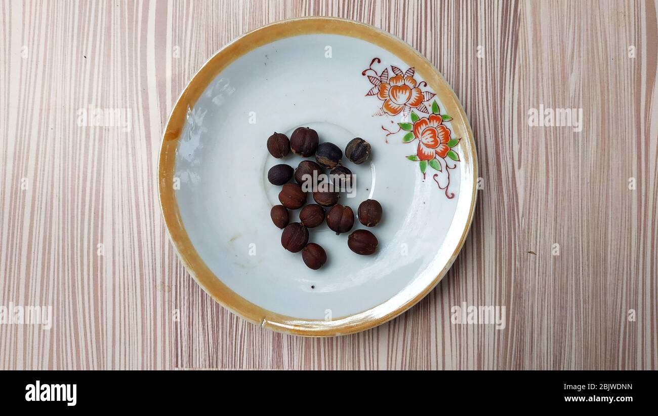 Unprocessed coffee beans, still pure Stock Photo - Alamy