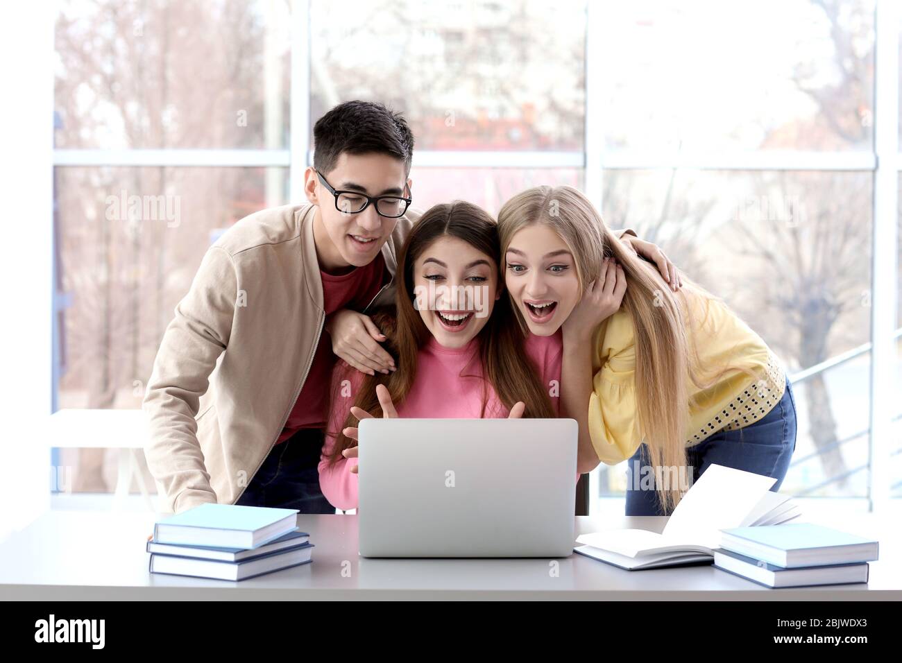 Excited students finding out their excellent grades for examination ...