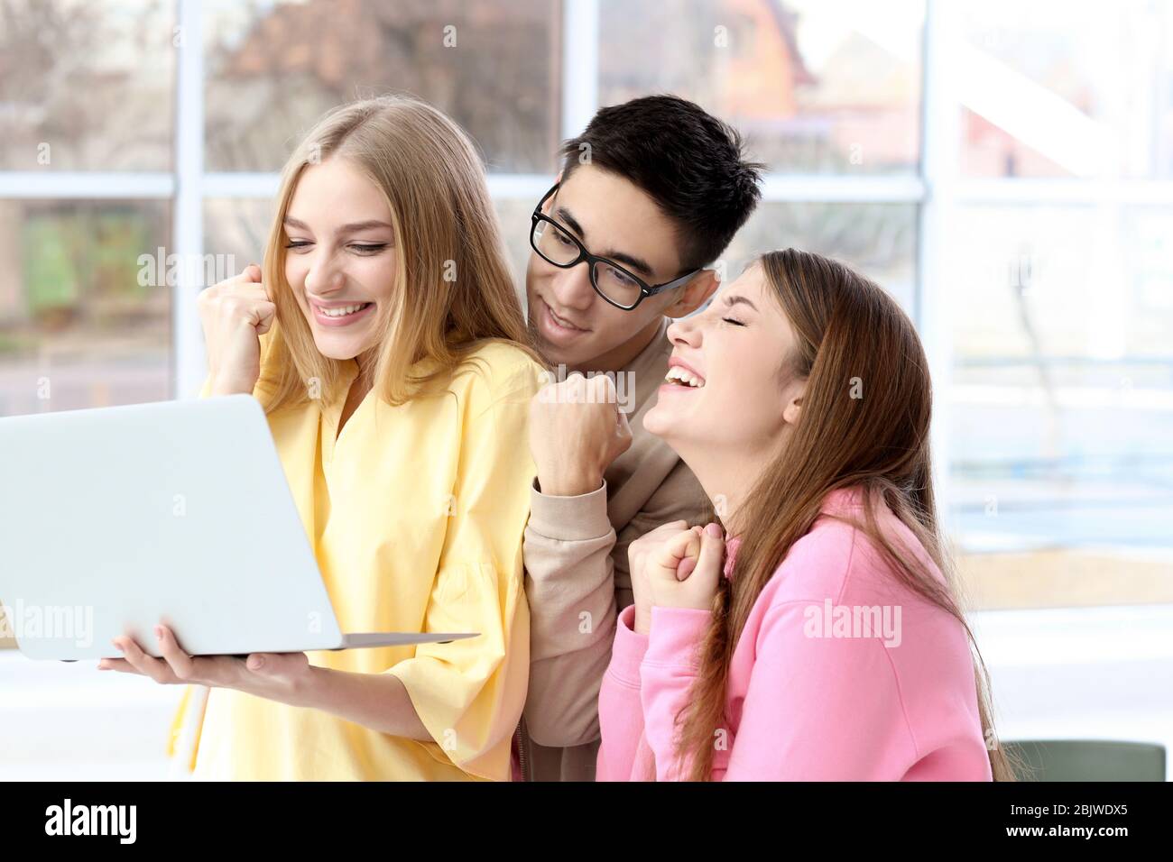 Excited students finding out their excellent grades for examination ...