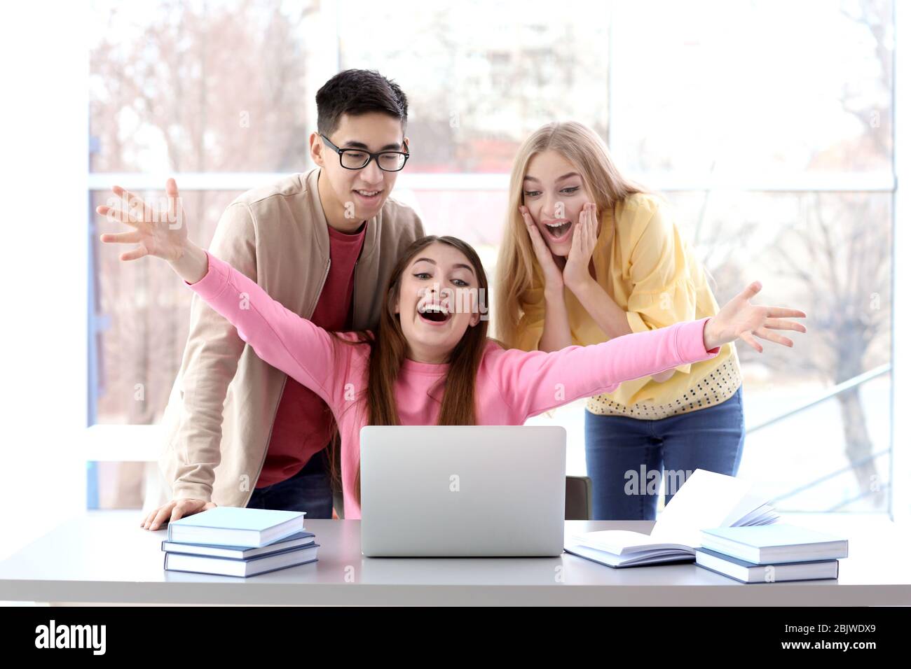 Excited students finding out their excellent grades for examination ...