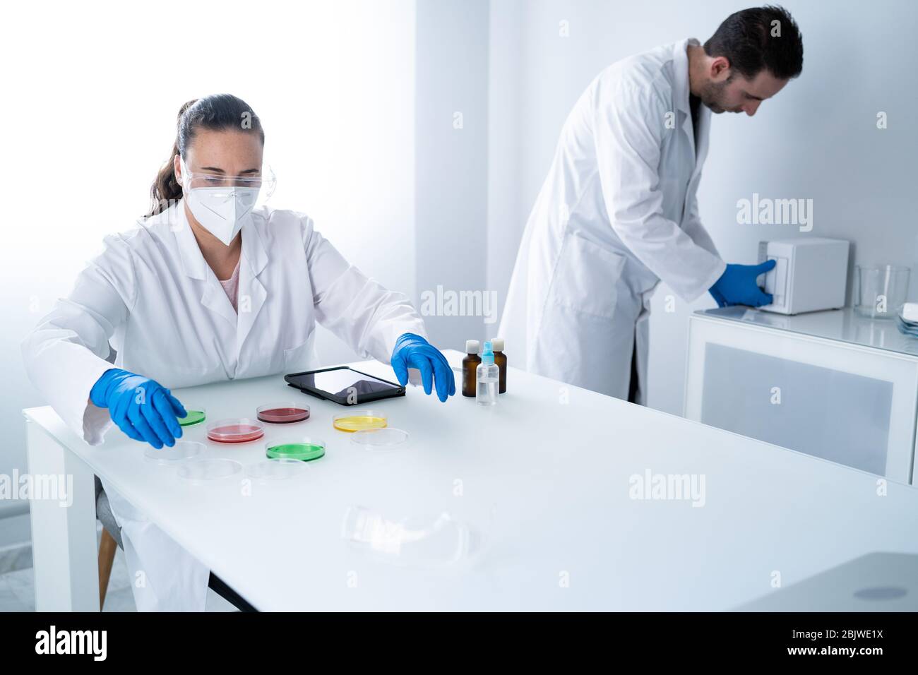 Young scientists or researchers working in the modern laboratory of ...