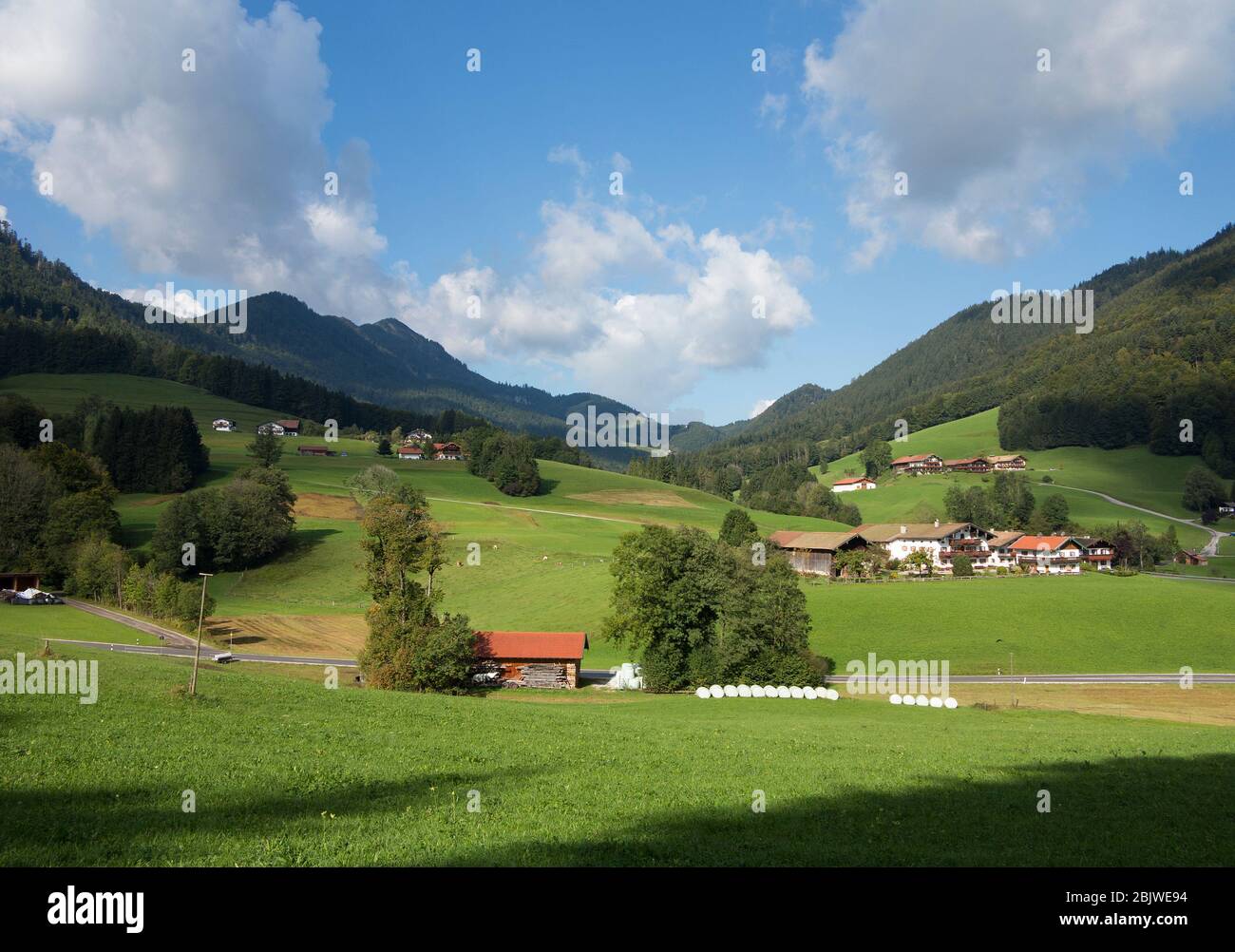 Idyllic Bavarian landscape with trees and mountains in Germany Stock ...