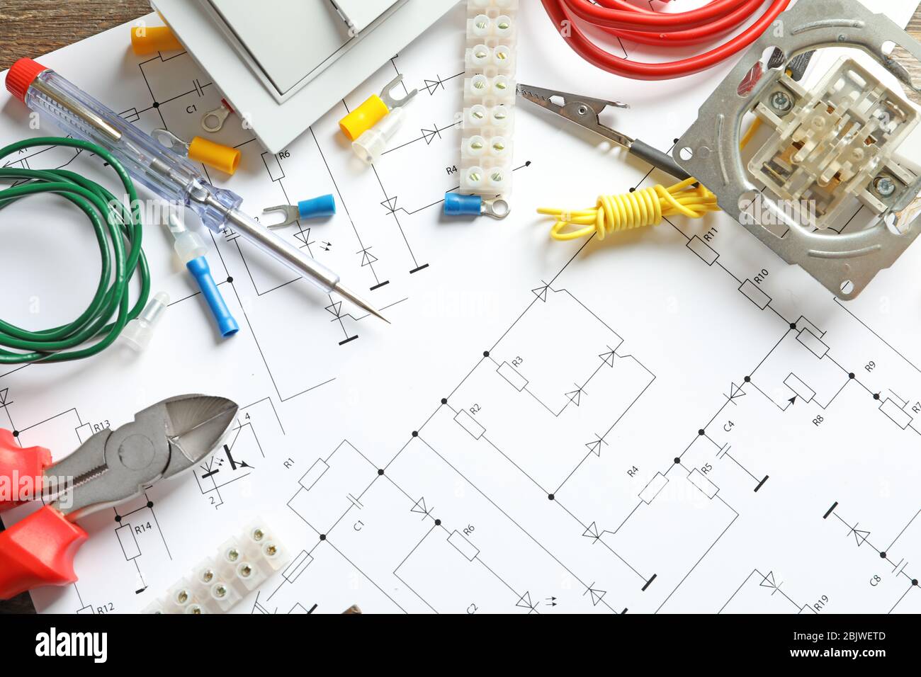 Different electrical tools on circuit diagram Stock Photo - Alamy