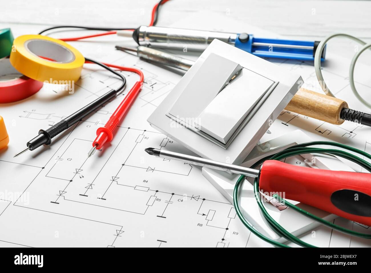 Different electrical tools on circuit diagram Stock Photo - Alamy