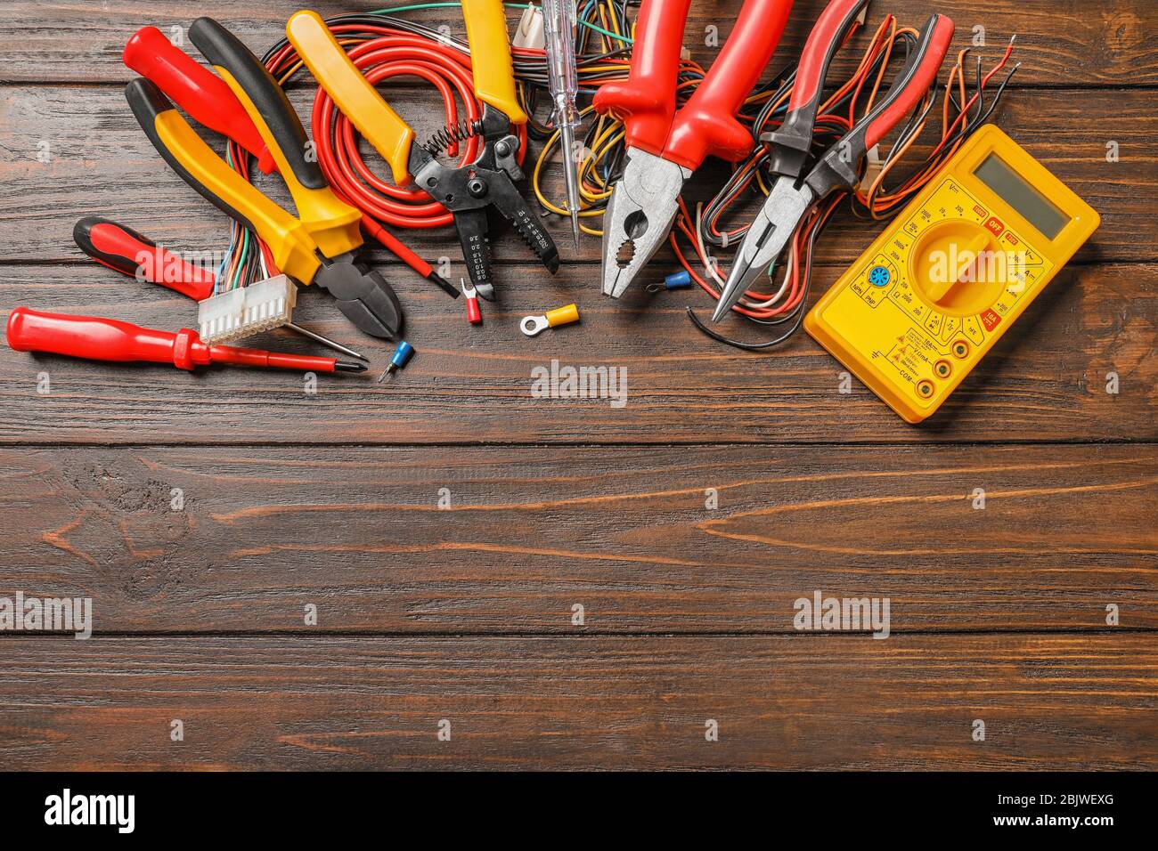 Different electrical tools on wooden background Stock Photo - Alamy