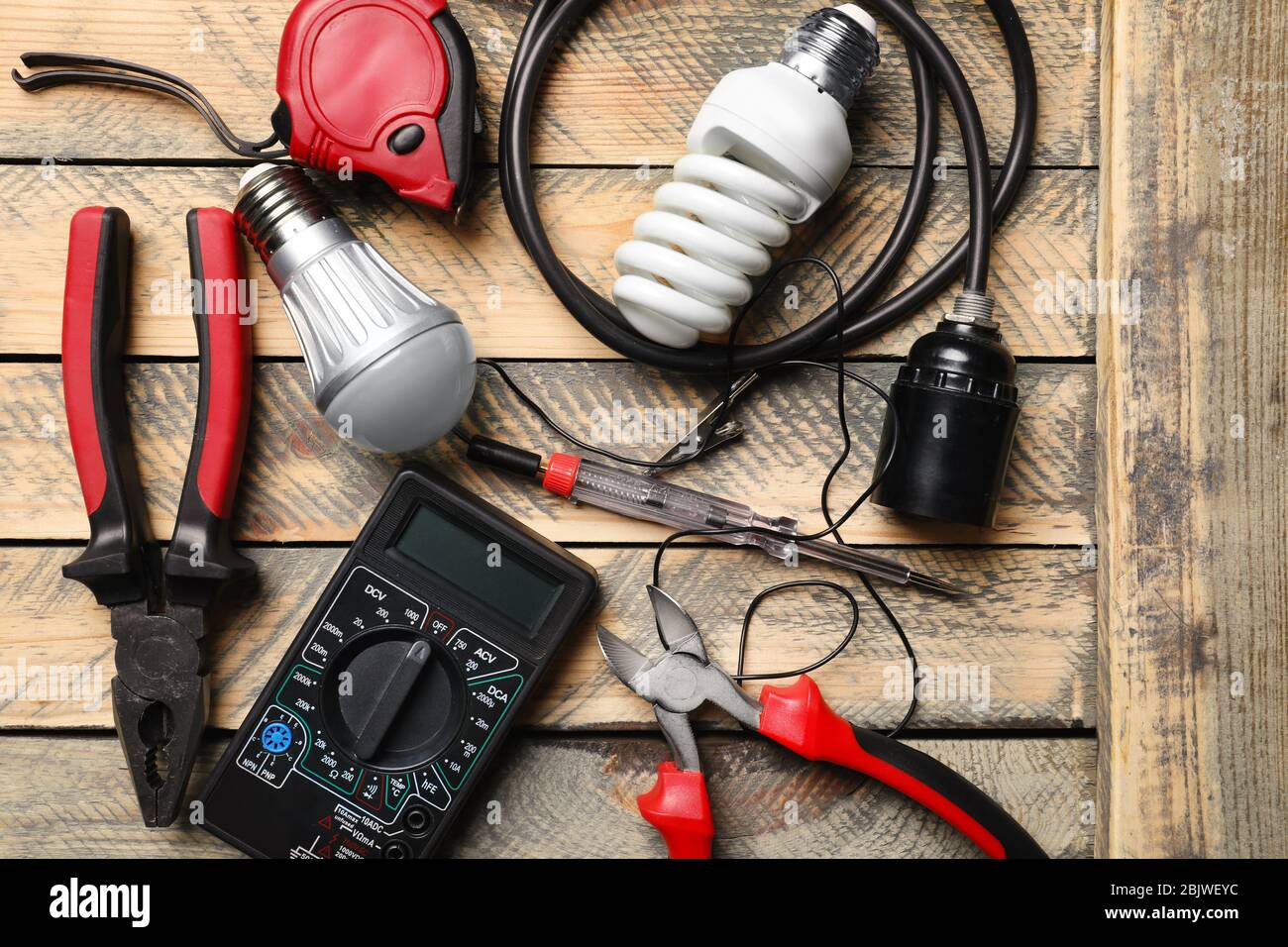 Different electrical tools on wooden background Stock Photo - Alamy