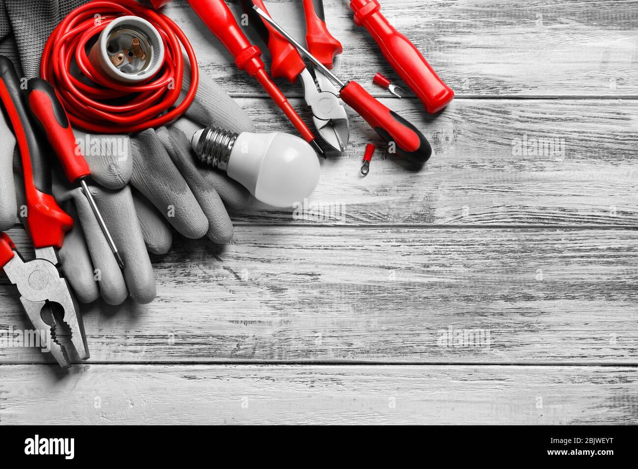 Different electrical tools on wooden background Stock Photo - Alamy