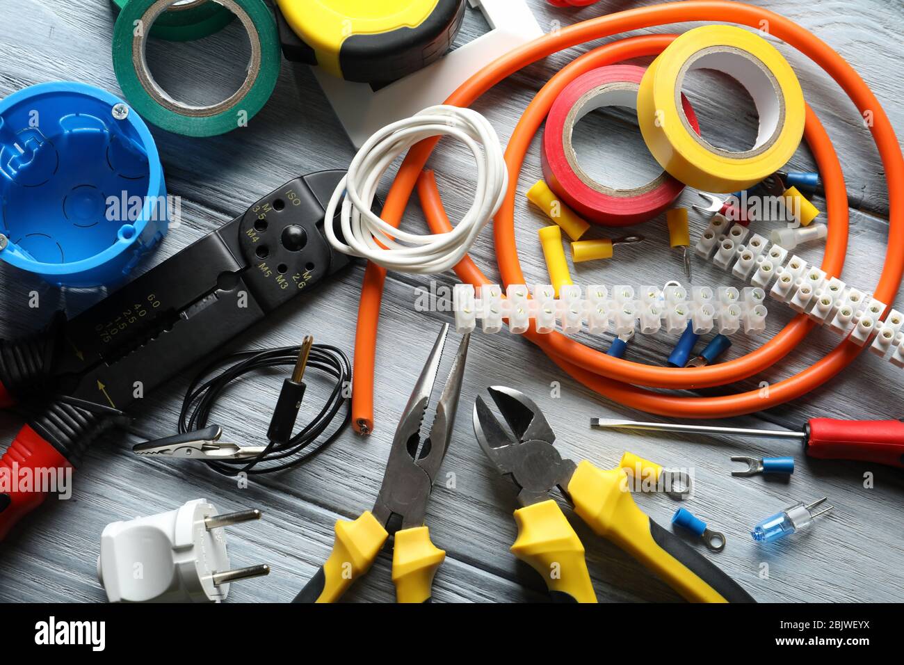 Different electrical tools on wooden background Stock Photo - Alamy