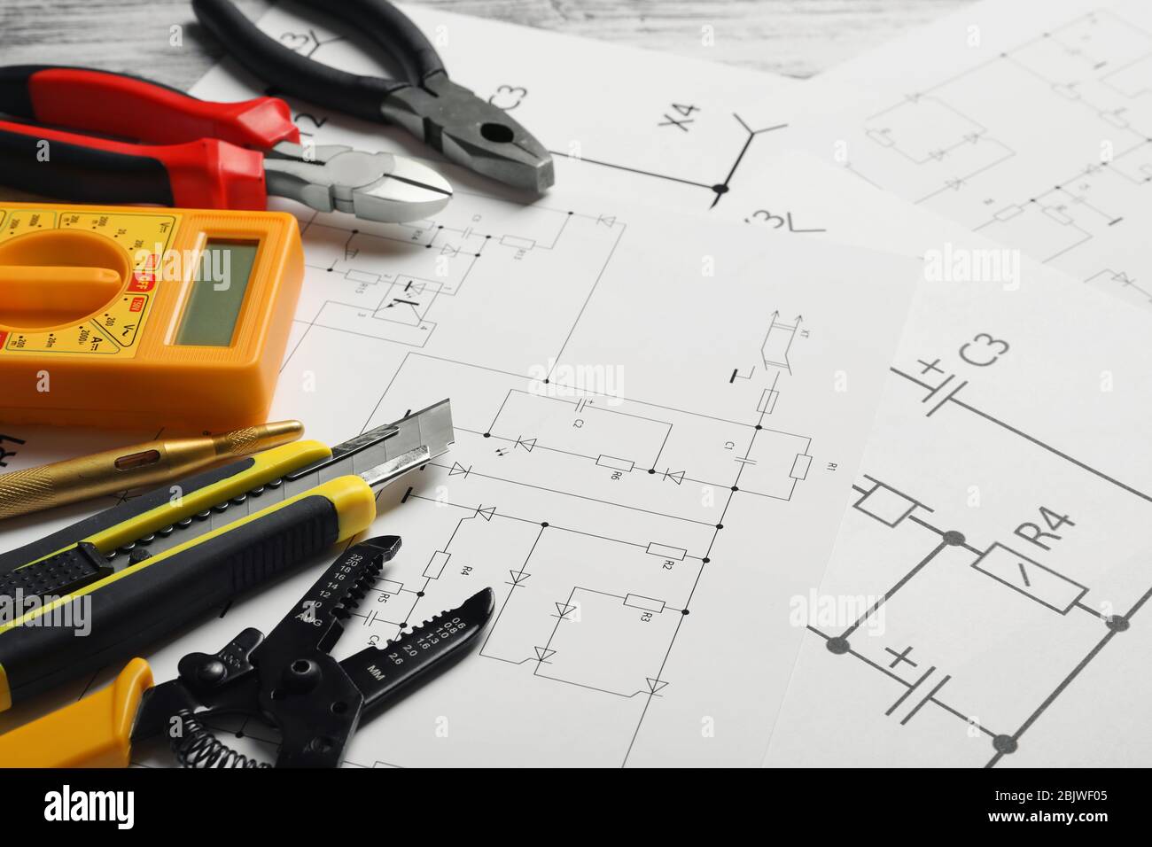 Different electrical tools on circuit diagram Stock Photo - Alamy